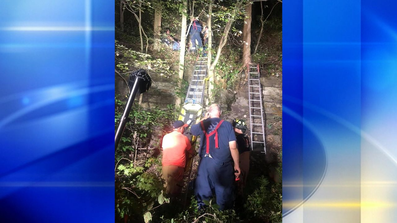 Difficult rescue saves man who fell down 60-foot embankment near train ...