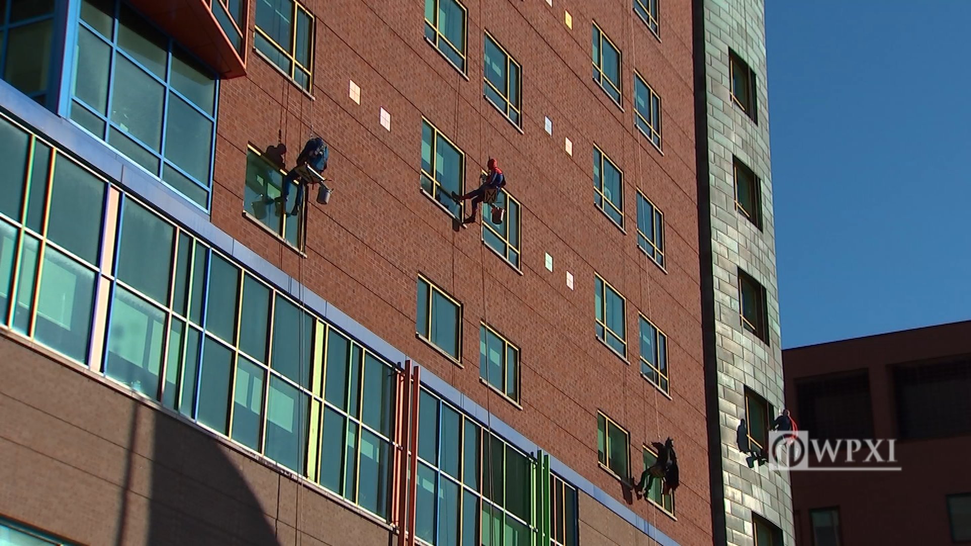 Superhero window washers bring smiles to patients at Children's ...
