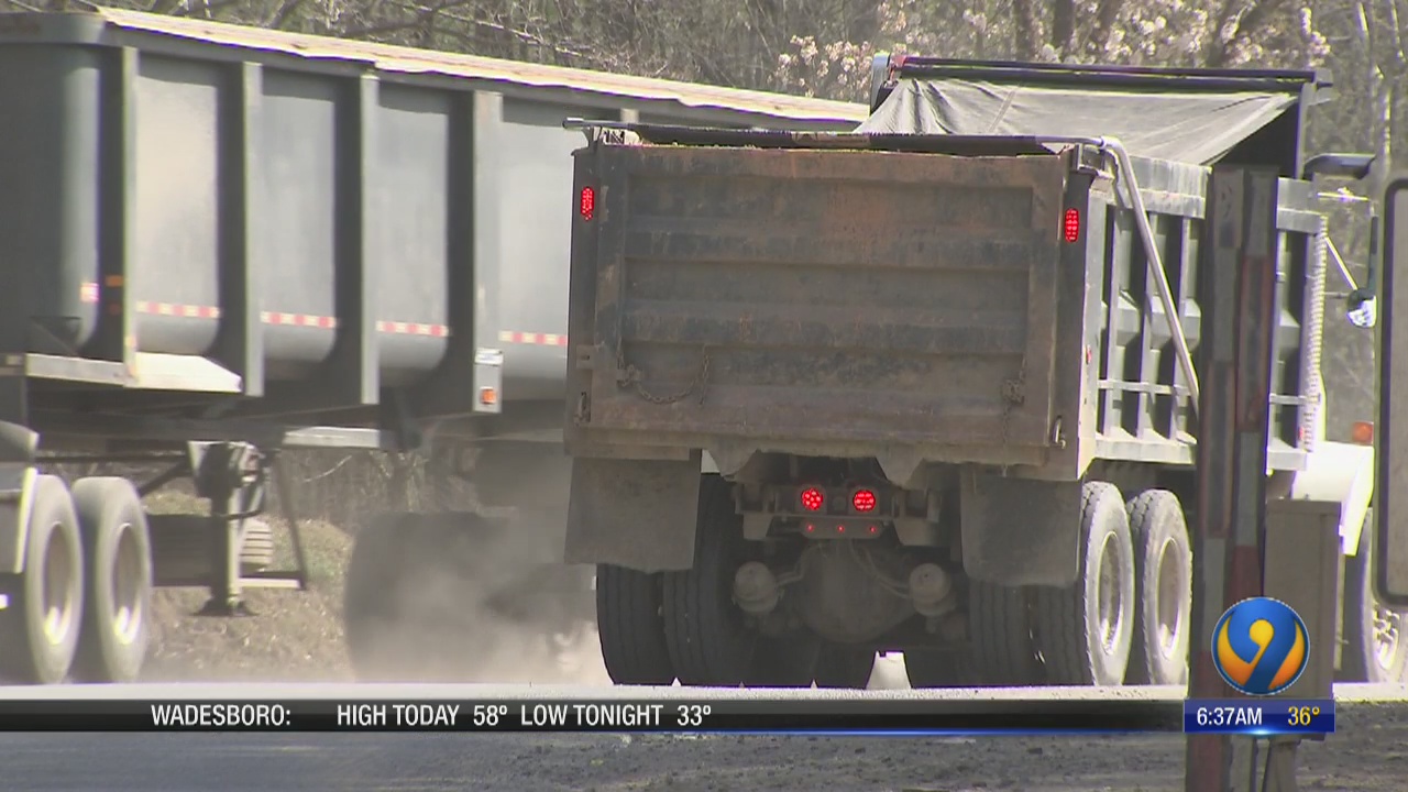 Garbage flying out of dump trucks near landfill in Concord turning area ...