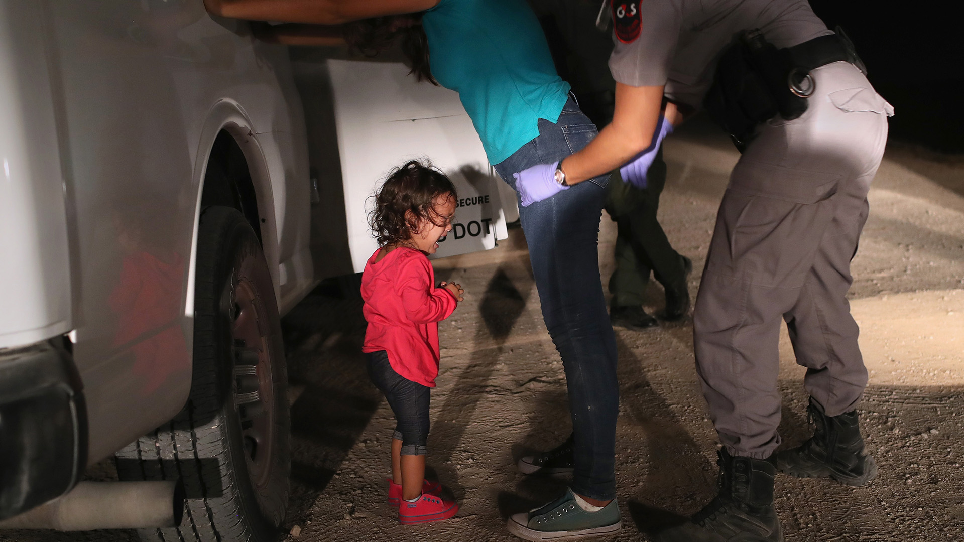 Behind the viral photo of toddler crying at the US border