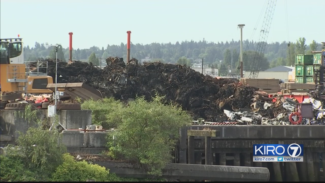 Firefighters remain at scene after crews battle barge fire in South Seattle