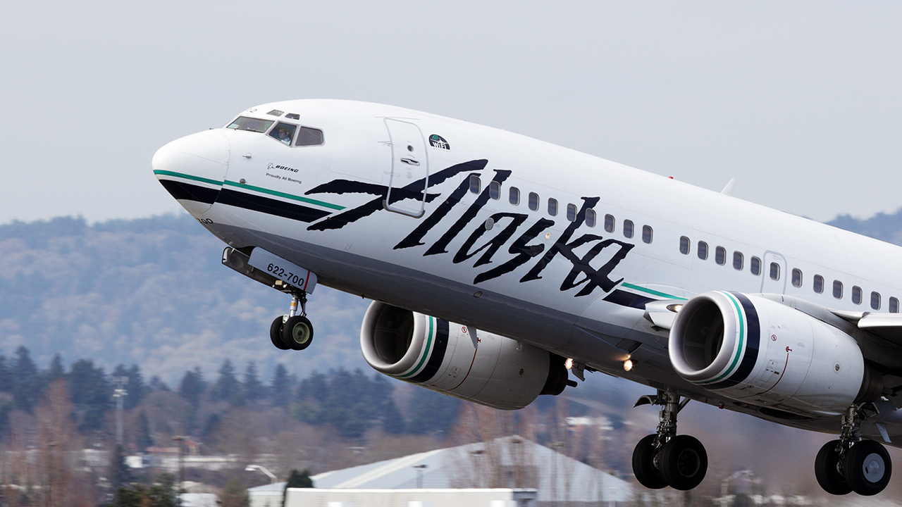 Passenger strips, streaks down aisle during Alaska Airlines flight