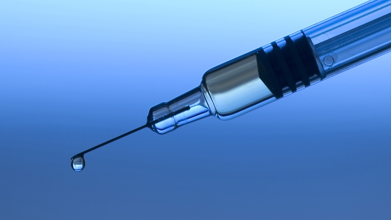 Suspect used hypodermic needle as weapon during robbery