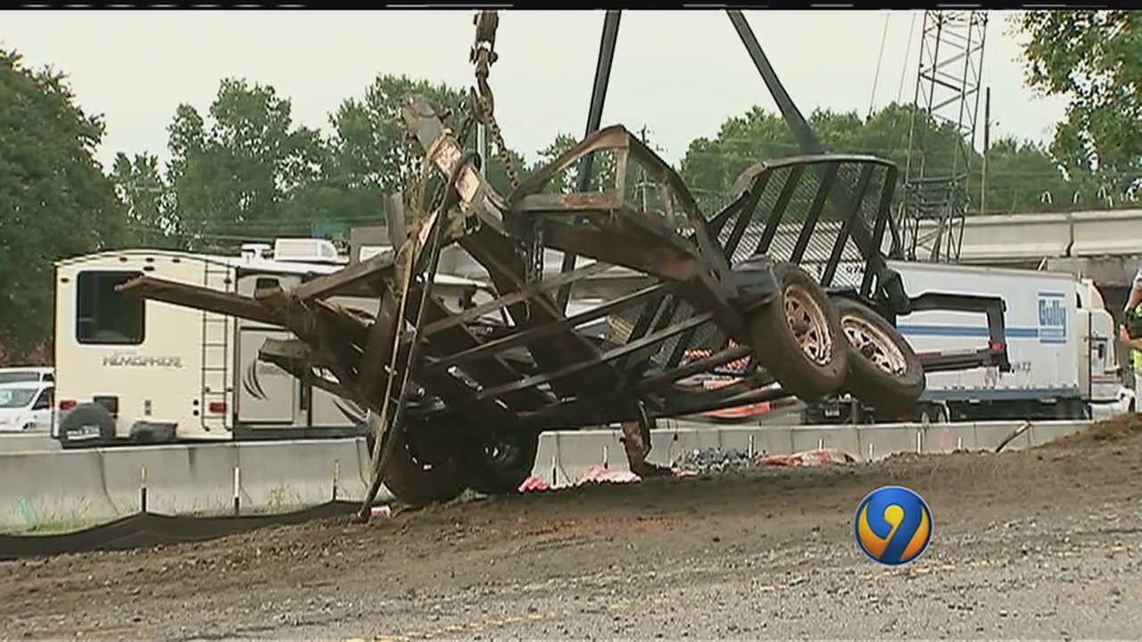 Crews upright tractor-trailer 10 hours after flipping over on I-77 ramp ...