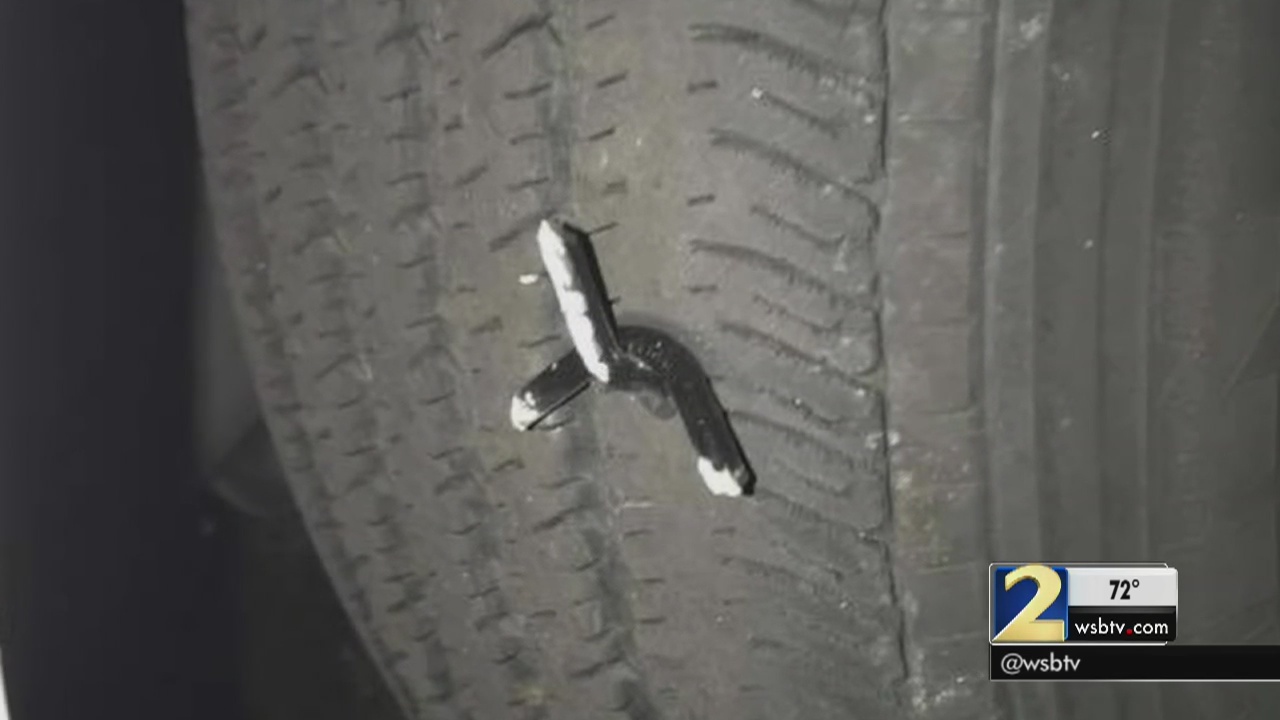 Neighbors believe someone put spikes in road to damage cars