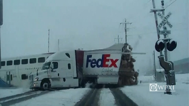 FedEx truck ripped apart at malfunctioning train crossing – WPXI