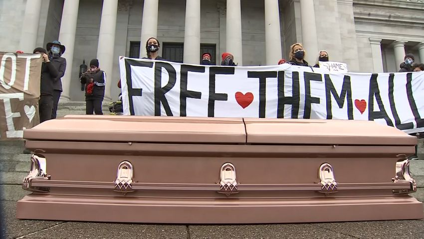 Mock funeral asks for prison COVID-19 safety – KIRO 7 News Seattle